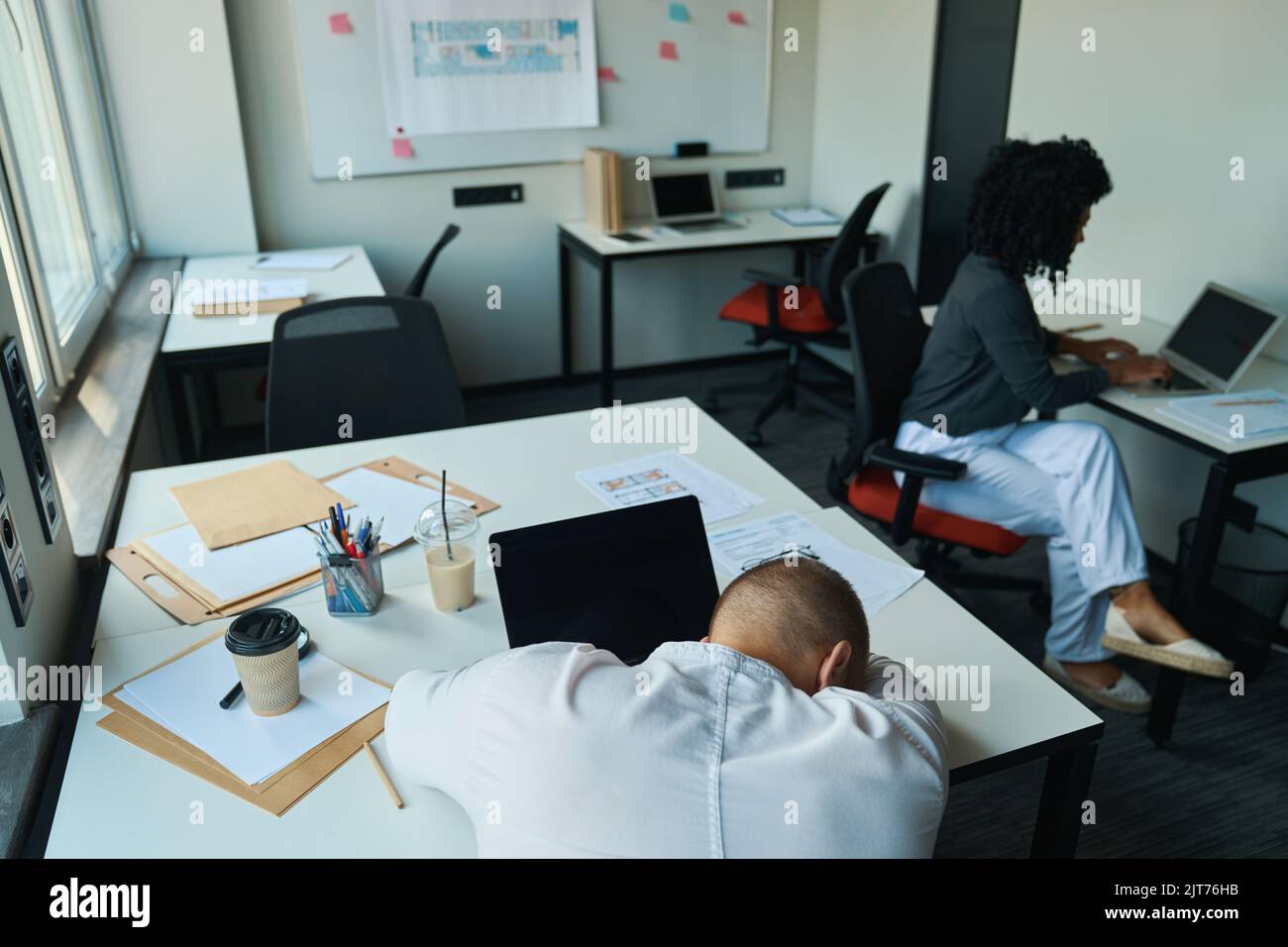 Exhausted manager fell asleep in the office at the workplace Stock ...