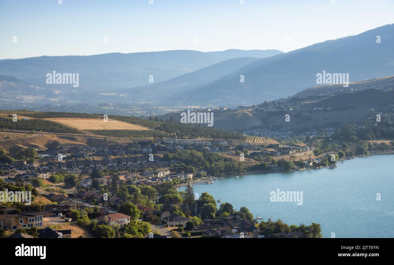 Scenic View of Kalamalka Lake and a small City during sunny summer ...