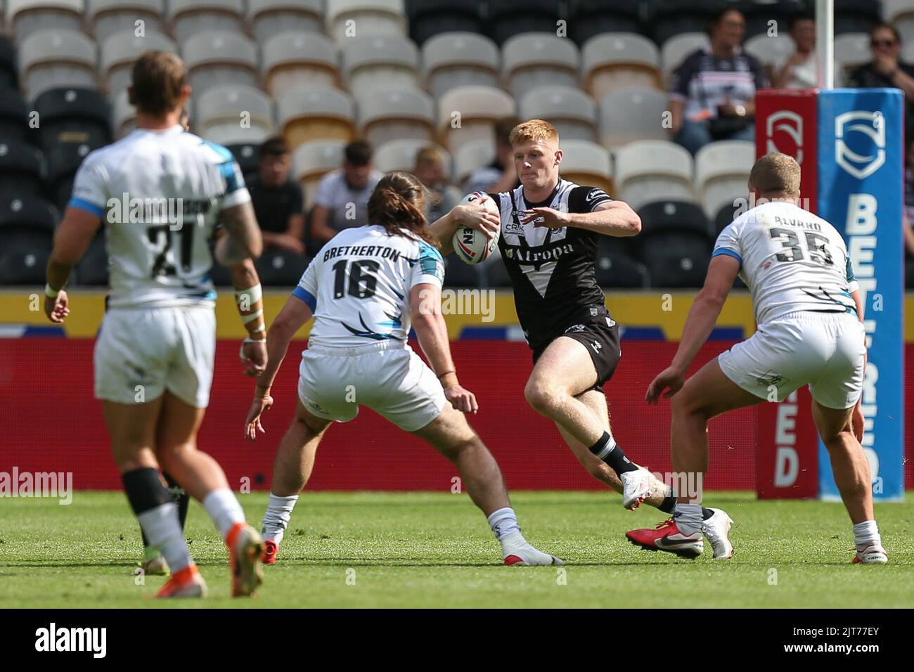 Harvey Barron #32 of Hull FC runs at Joe Bretherton #16 of Toulouse ...