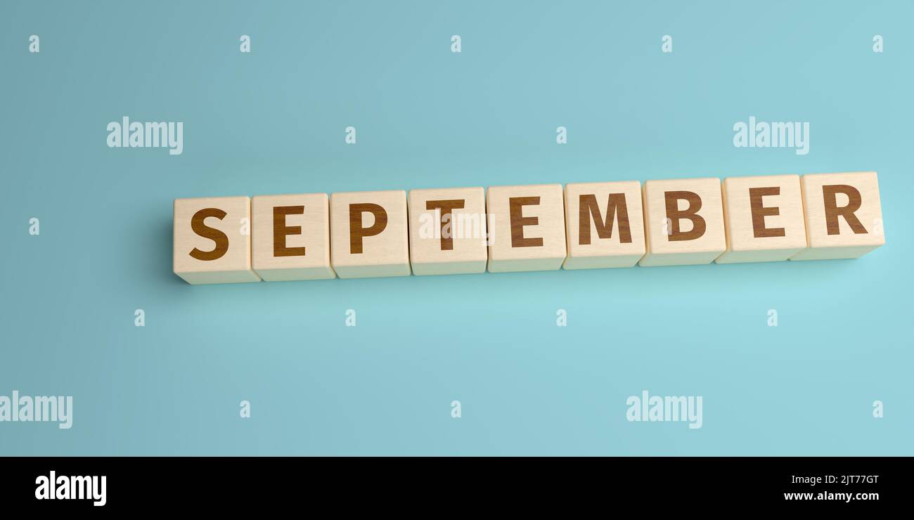 The word September built from letters on wooden cubes. High angle view ...