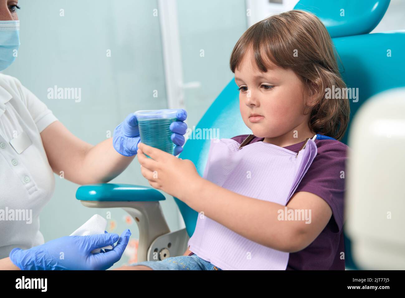 Female child using mouthrinse after dental procedure Stock Photo - Alamy