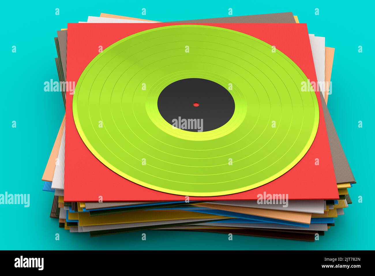 Black vinyl LP record with heap of covers isolated on green background ...