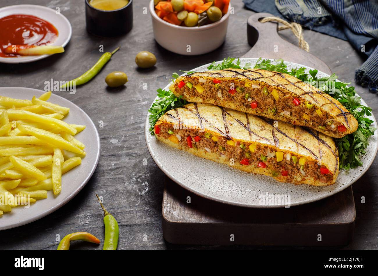 Arabic cuisine; Traditional Egyptian food "Hawawshi". It's flat ...