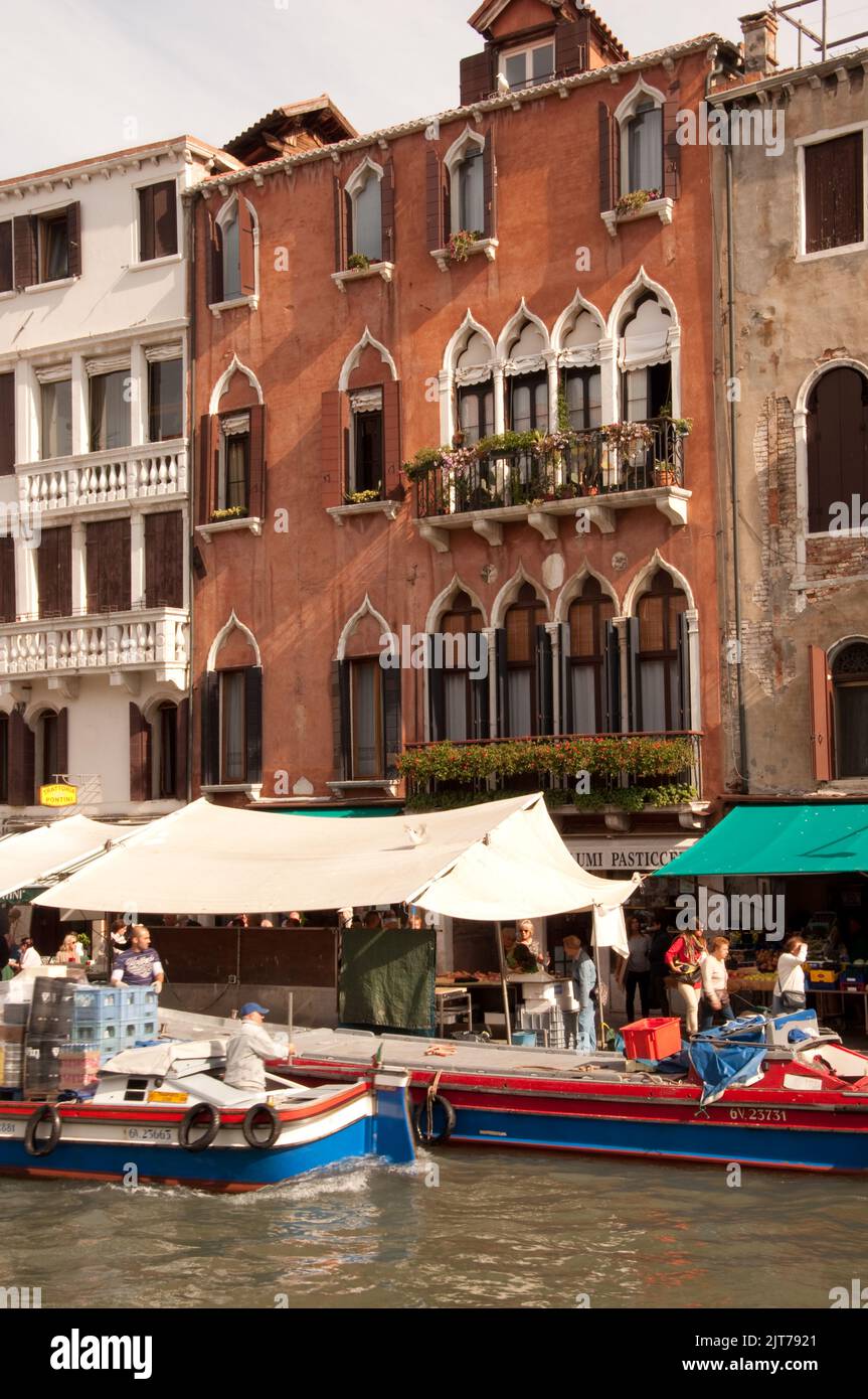 Houses and boats along a canal, Venice, Italy. Typical Venetian ...