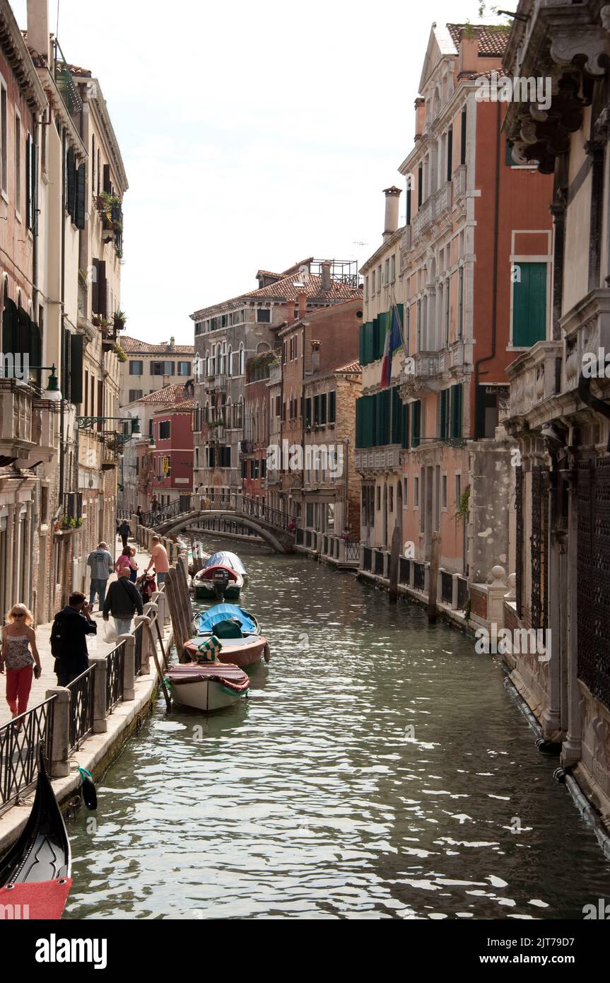 Small side canal, Venice, Italy. Venice is famous for its canals which ...