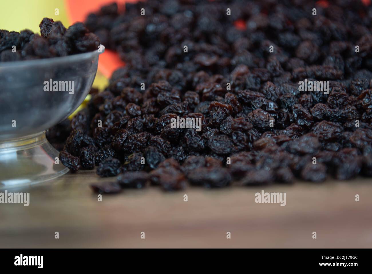 Dried black raisins. Raisins are obtained by dehydrating fresh grapes ...