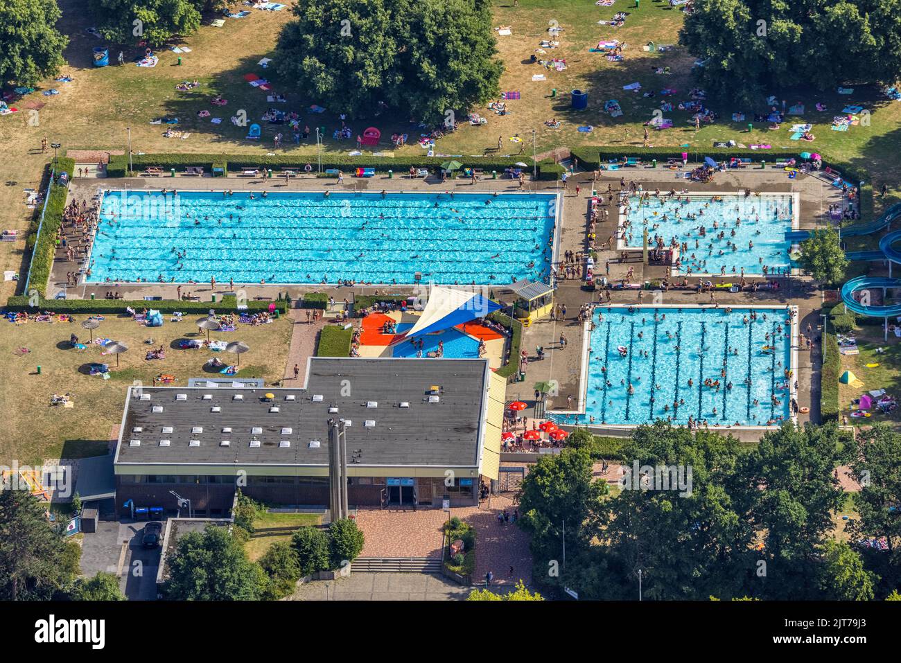 Aerial view of swimming fun in open air swimming pool Berge, Rhynern ...
