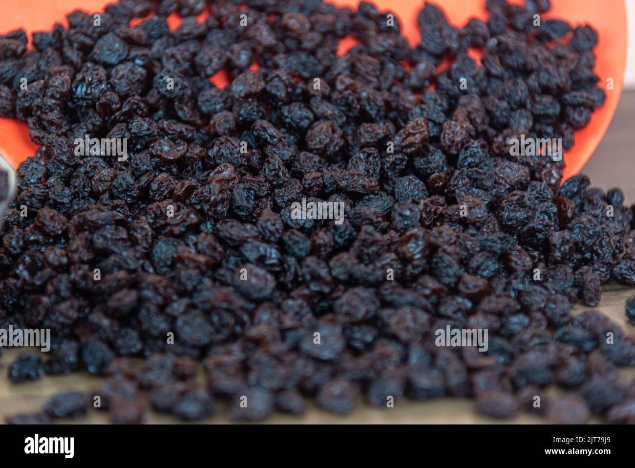 Dried black raisins. Raisins are obtained by dehydrating fresh grapes ...