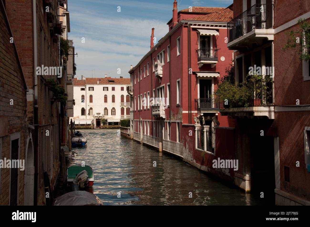Small side canal, Venice, Italy. Venice is famous for its canals which ...