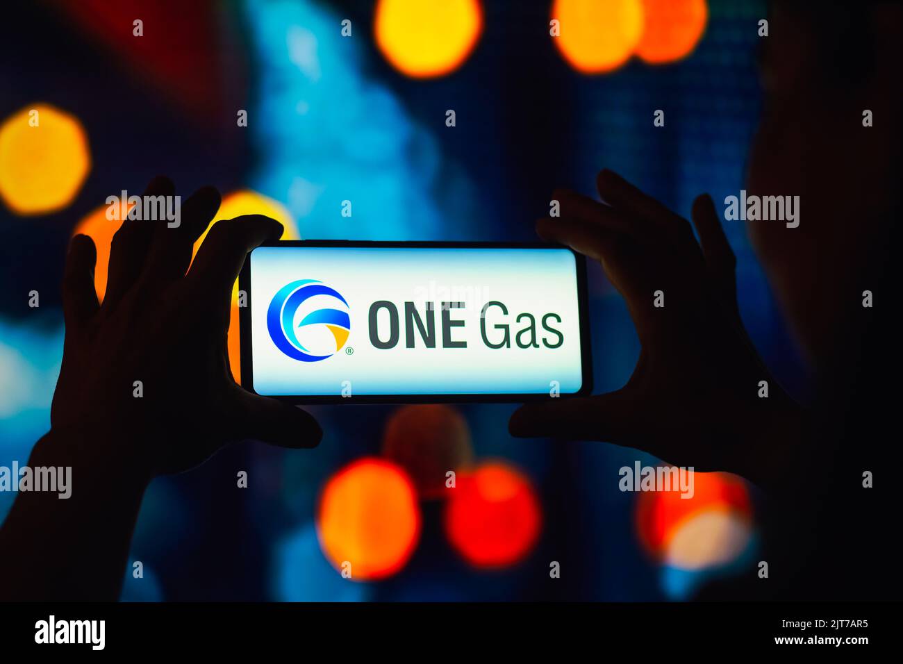 In this photo illustration, the ONE Gas, Inc. logo is displayed on a ...
