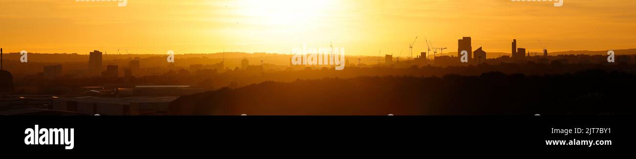 Leeds City Centre skyline silhouetted against a sunset. This view was ...