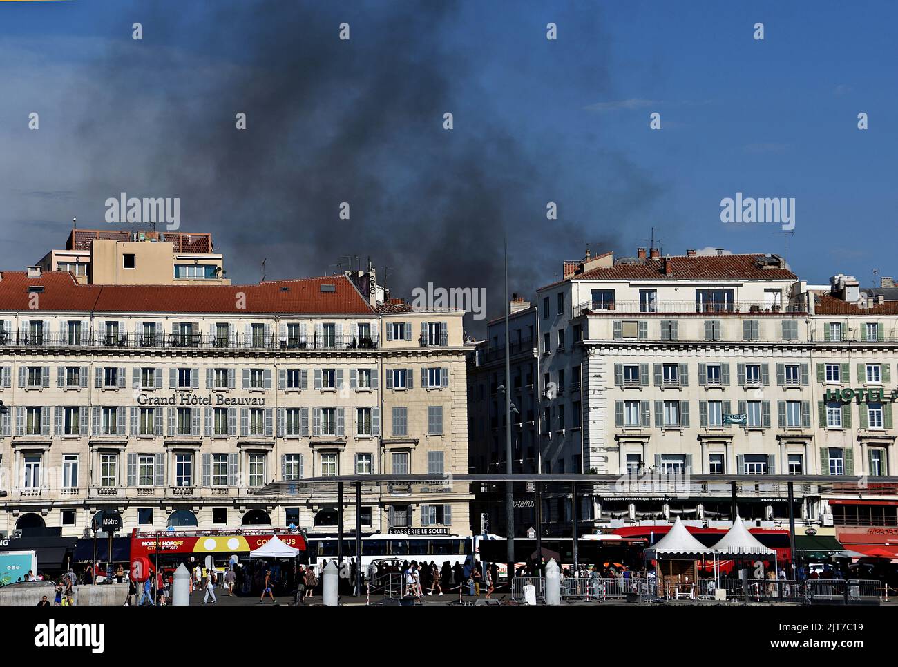 Smoke is seen between buildings during an apartment fire in Marseille ...