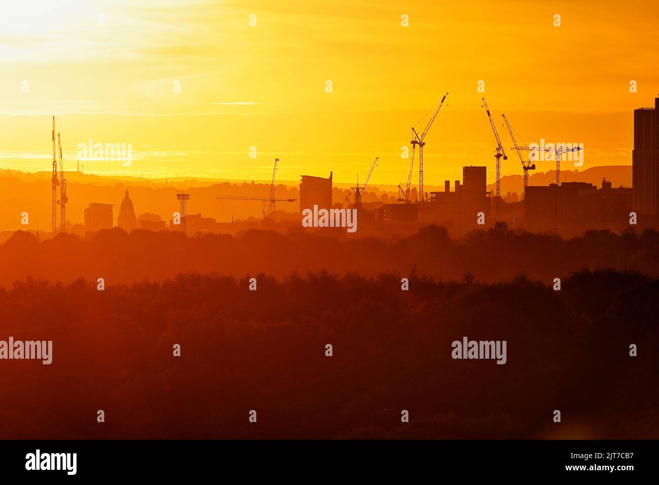 Leeds City Centre skyline silhouetted against a sunset. This view was ...