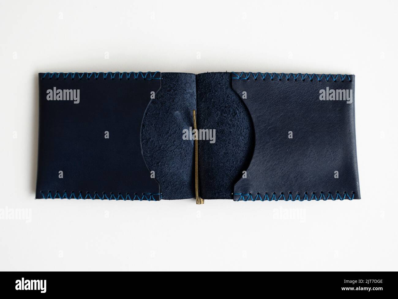 Open empty blue money clip handmade from genuine leather on white ...