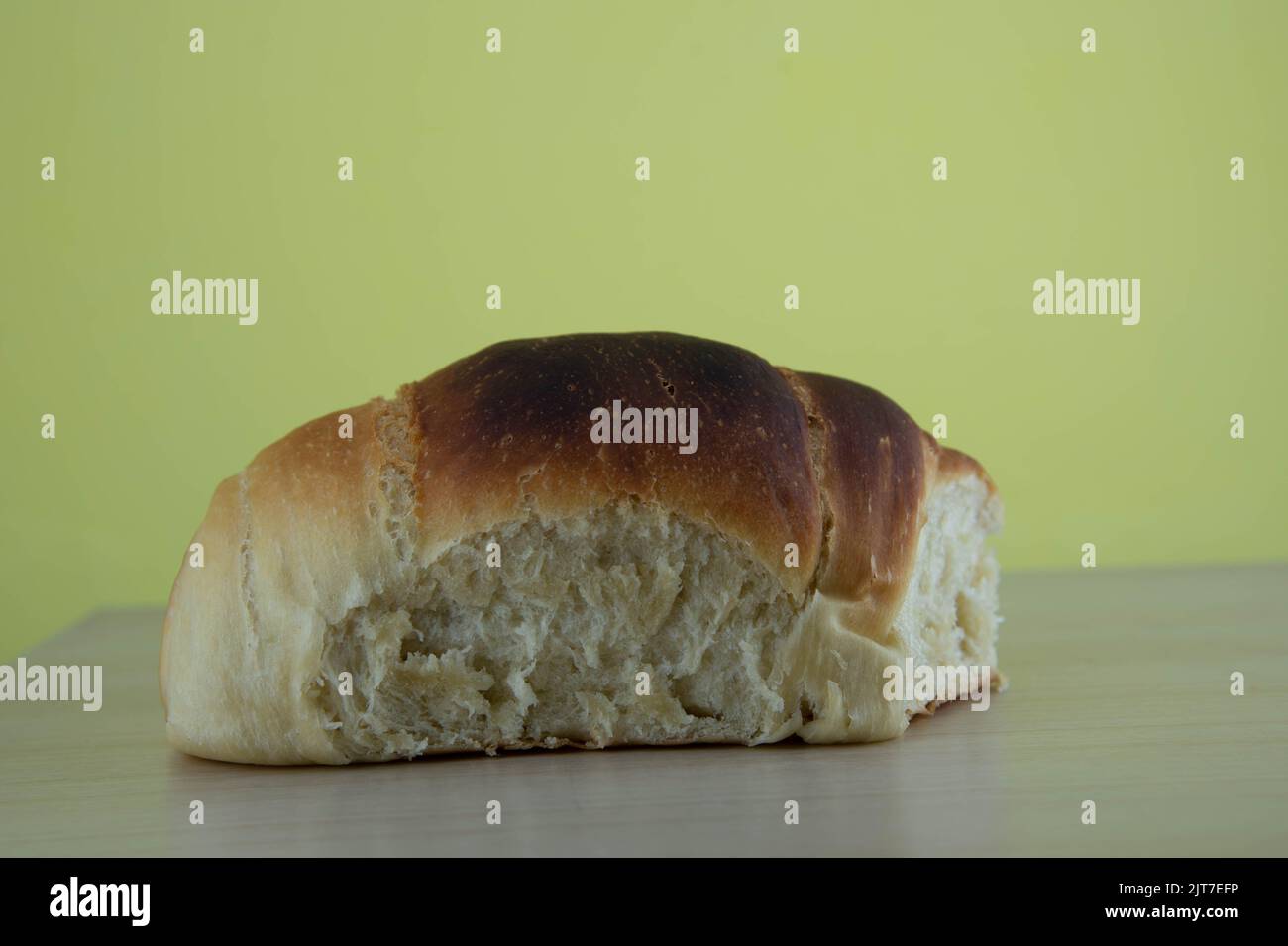 Wheat bread made by hand. Homebread. Common food, made with flour, water, salt and yeast Stock ...