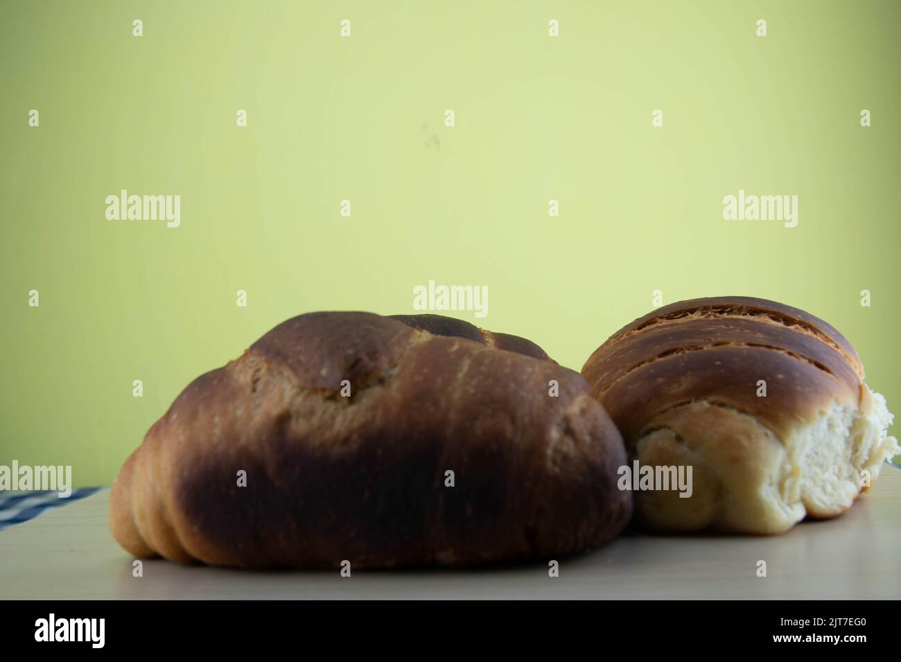 Wheat bread made by hand. Homebread. Common food, made with flour, water, salt and yeast Stock ...