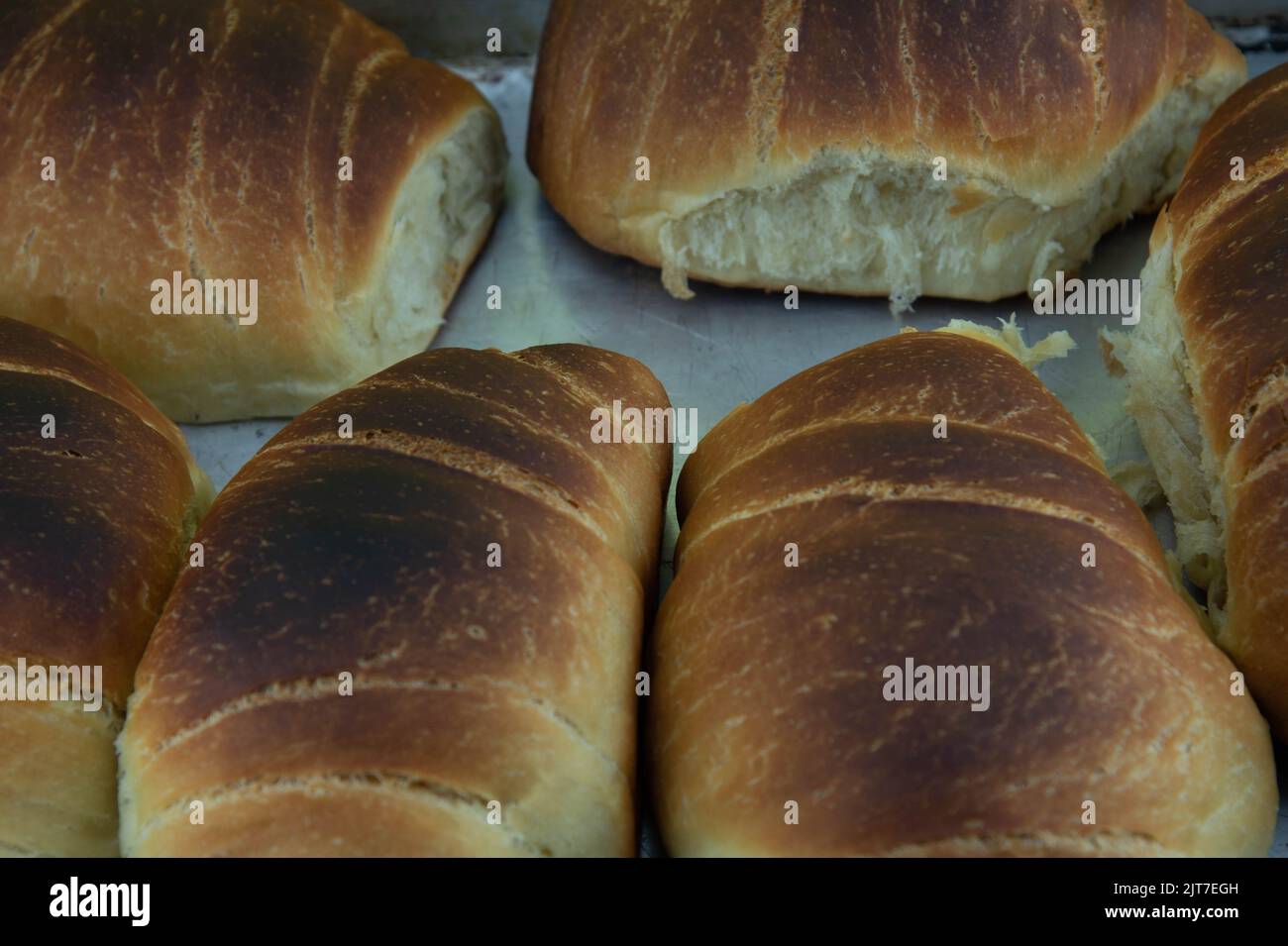 Wheat bread made by hand. Homebread. Common food, made with flour, water, salt and yeast Stock ...