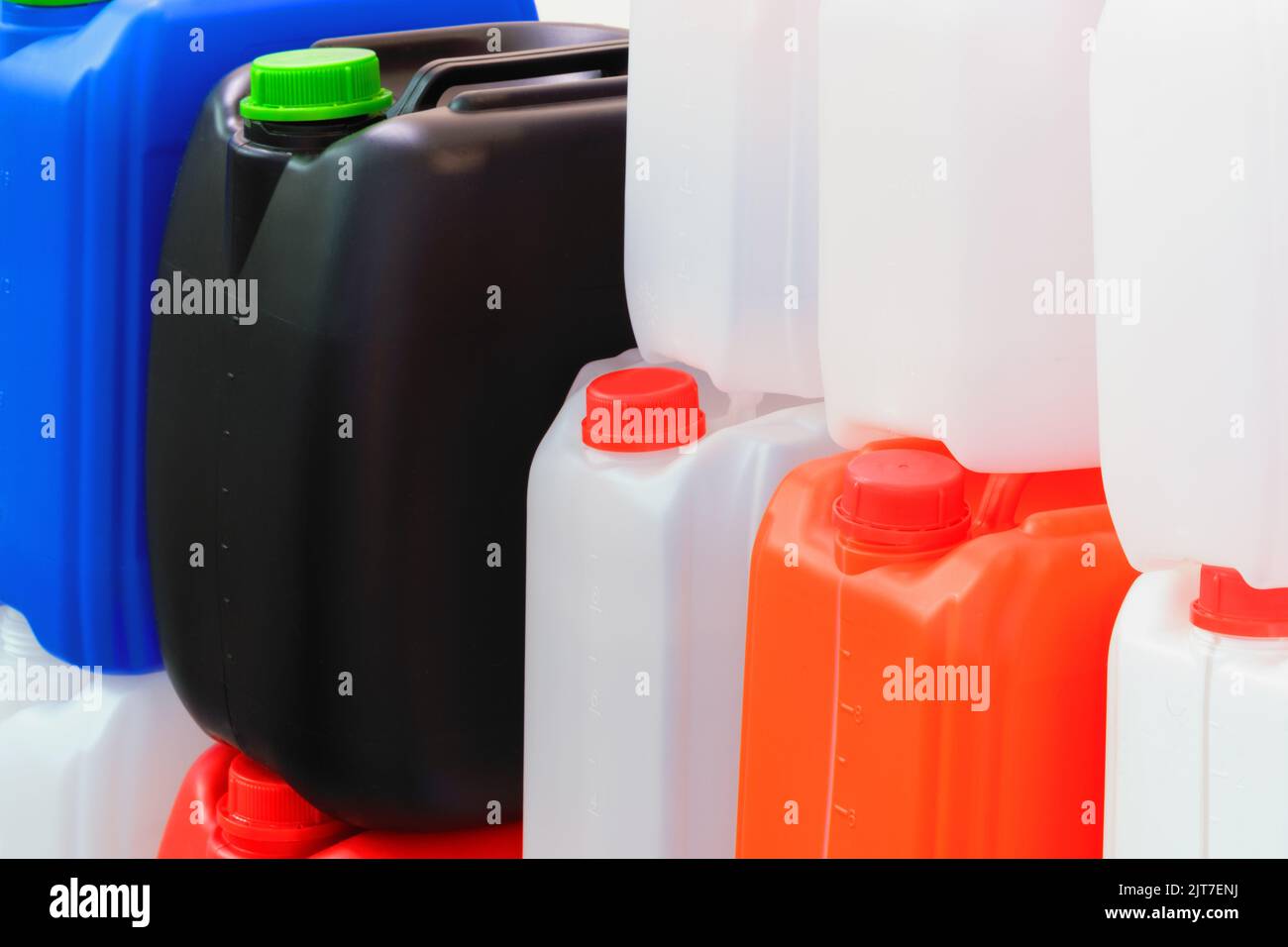 Multicolored plastic jerry can containers Stock Photo - Alamy
