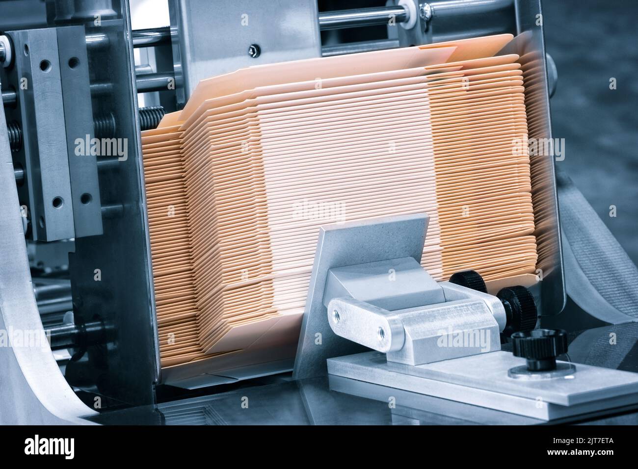 Elements of corton boxes are collected in stack. Conveyor line for the ...