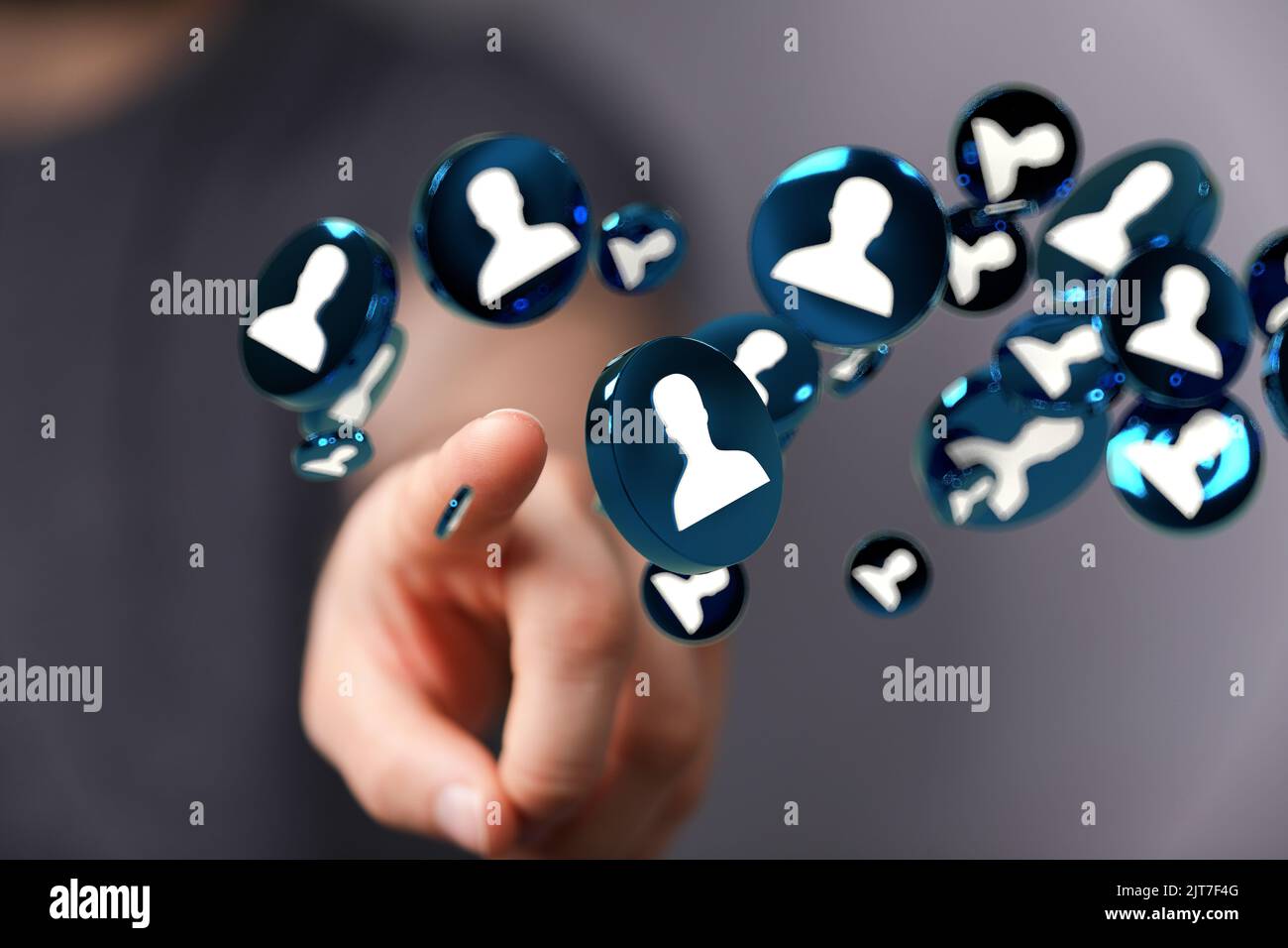 The finger pointing to the network of blue social media follower icons ...