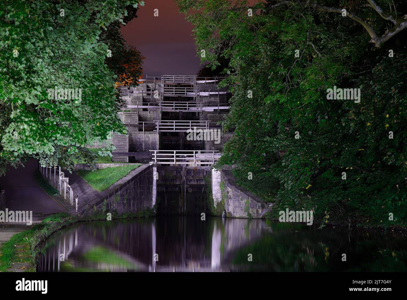 Five Rise Locks illuminated by torch light at night in Bingley,West ...
