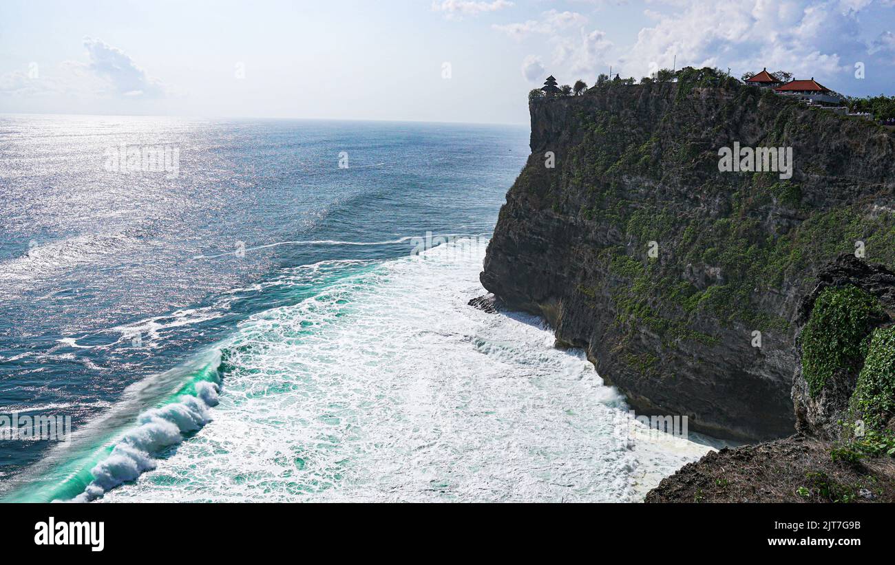 breathtaking coastline cliff view with blue and white crushing waves ...