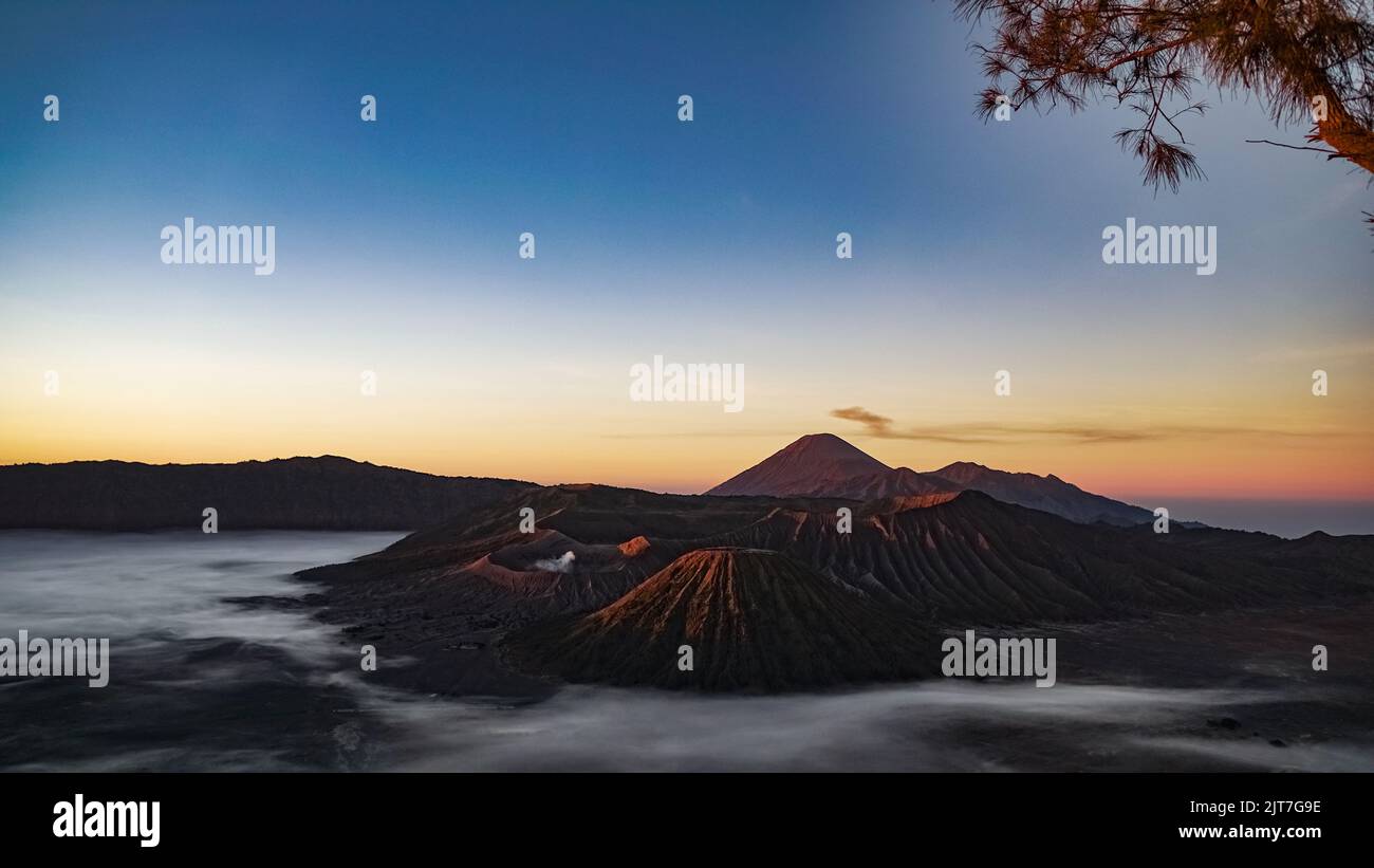 mystic and surreal panoramic mountain view of Bromo volcano craters ...