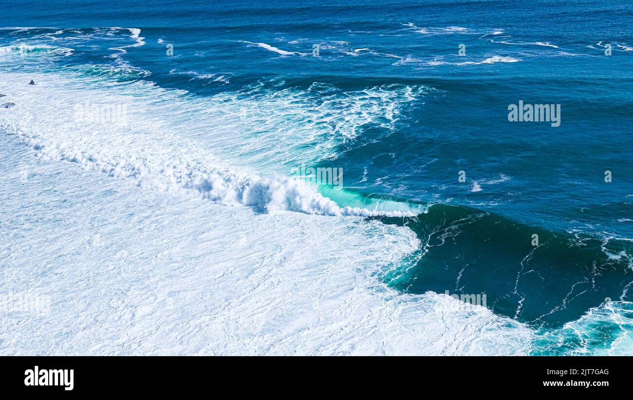 wide view of big blue and white waves crushing on coastline of Bali ...