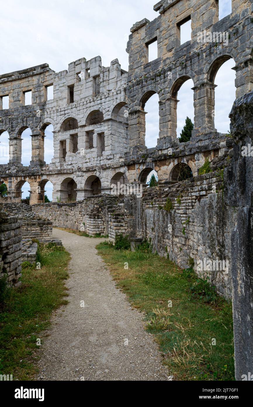 Tourists walk along ancient paths to marvel at Pula's ancient ...