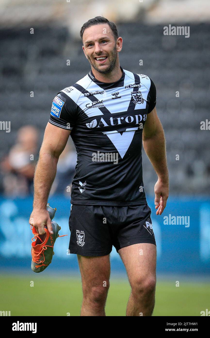 Luke Gale #7 of Hull FC takes his boots off after the game and smiles ...