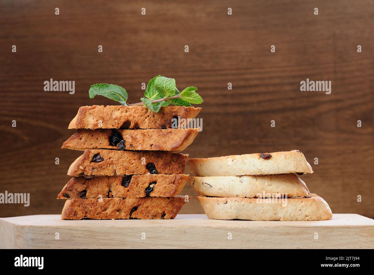 Italian biscotti in two piles with fresh mint vertical Stock Photo - Alamy