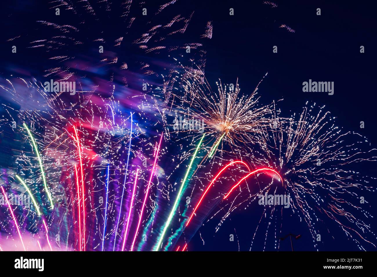 Beautiful multi-colored fireworks against the background of the night ...