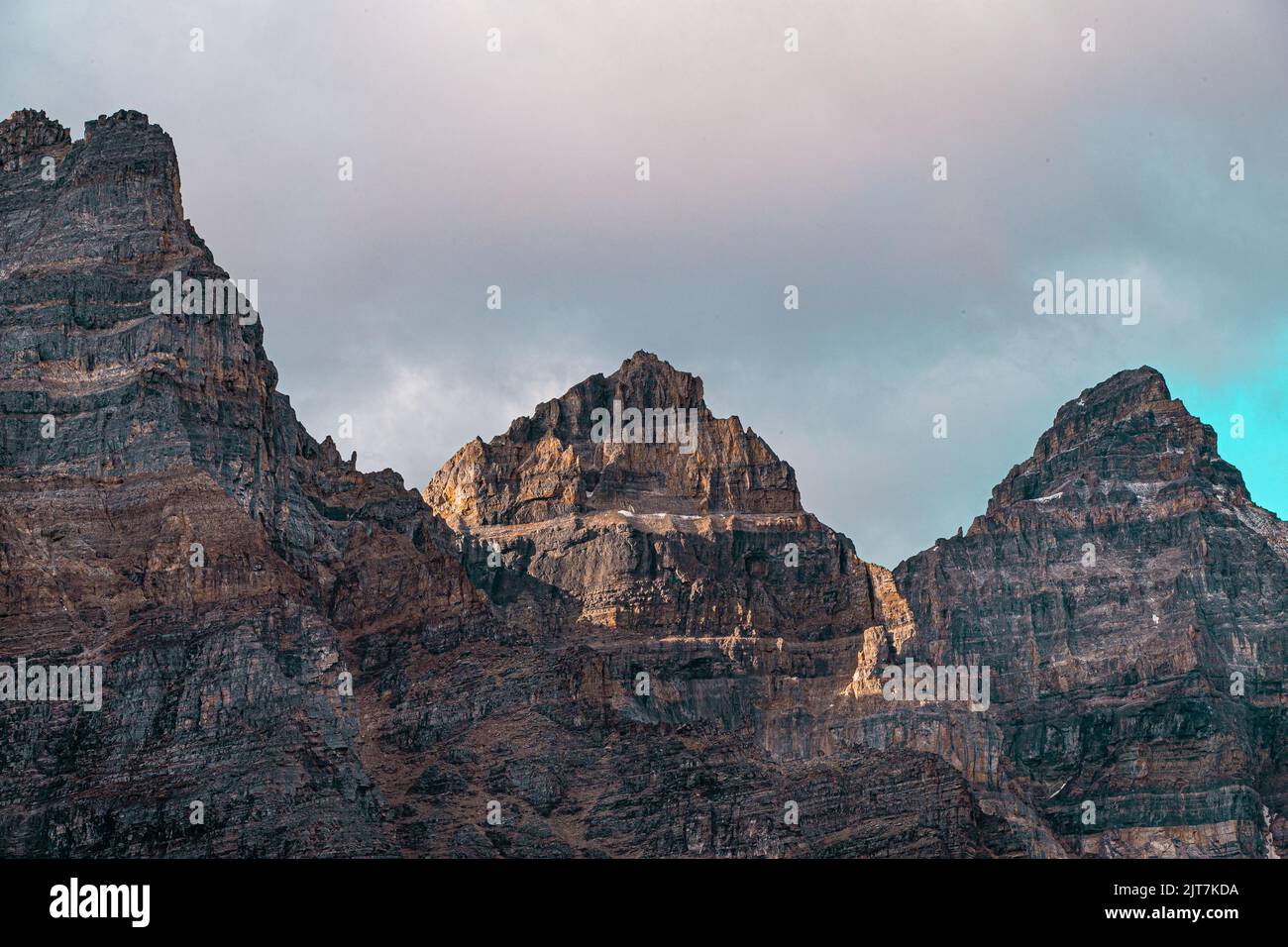 The beautiful bald rocky mountains under the cloudy sky in Banff ...