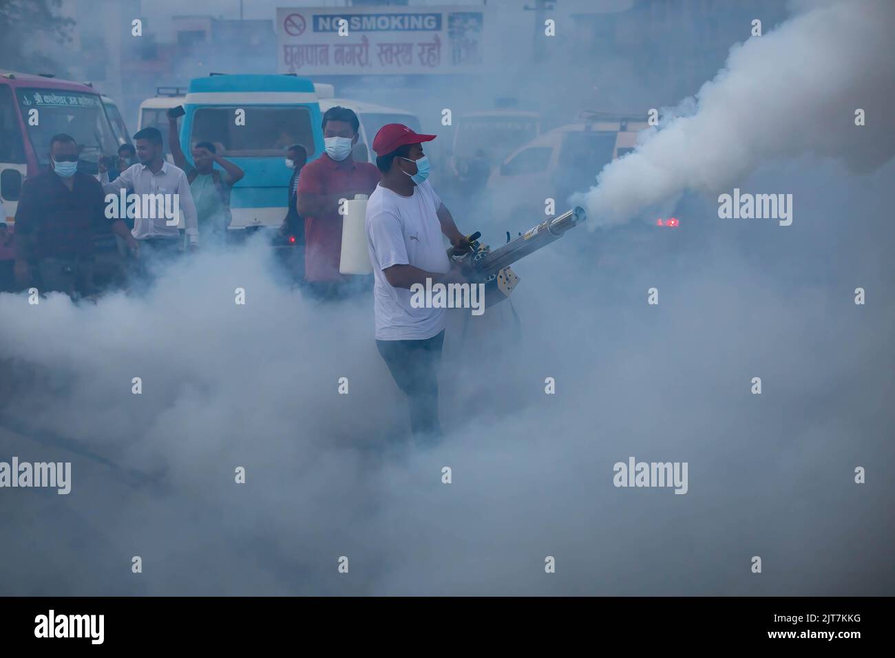 Lalitpur, Nepal. 28th Aug, 2022. A man fumigates the area to kill ...