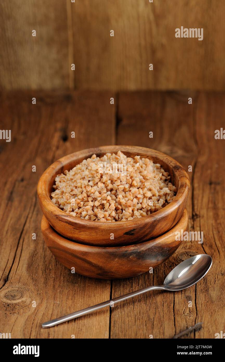 Russian buckwheat kasha in wooden bowl with space background Stock ...