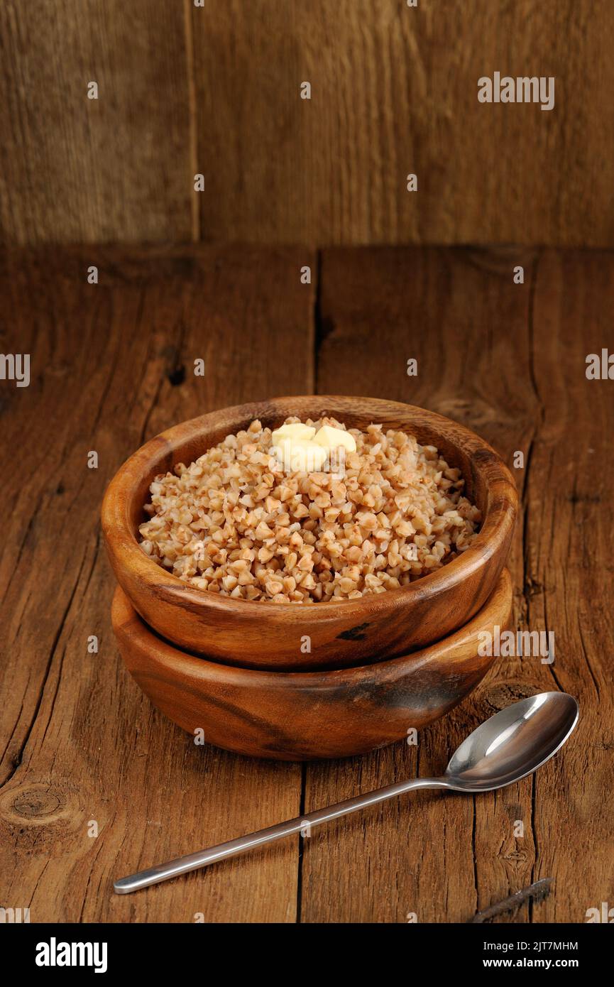 Russian buckwheat kasha in wooden bowl with space background Stock ...