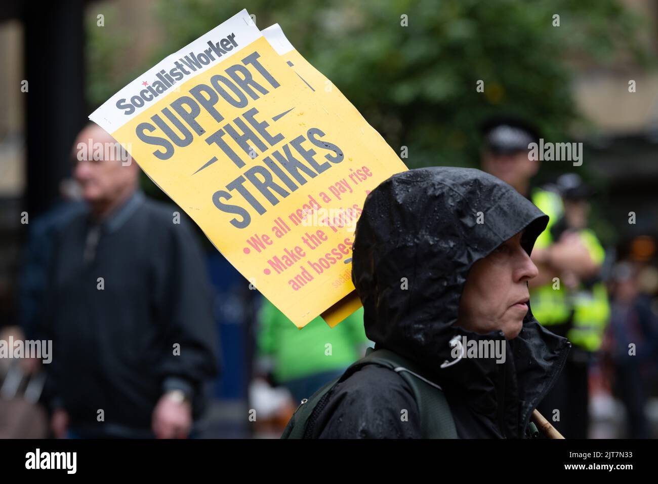 Socialist Worker 'Support the Strikes' placard held by person at joint ...