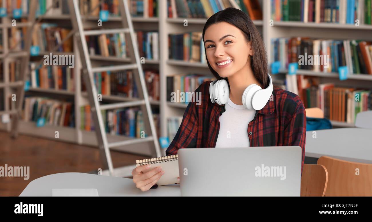 Female student preparing for exam in library Stock Photo - Alamy