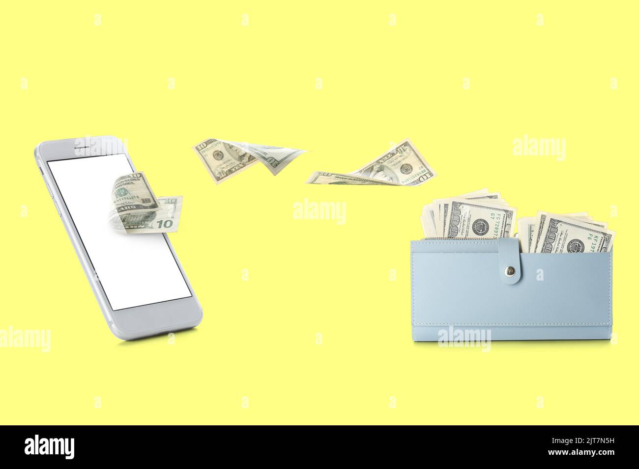 Modern mobile phone with wallet and flying dollar banknotes on yellow ...