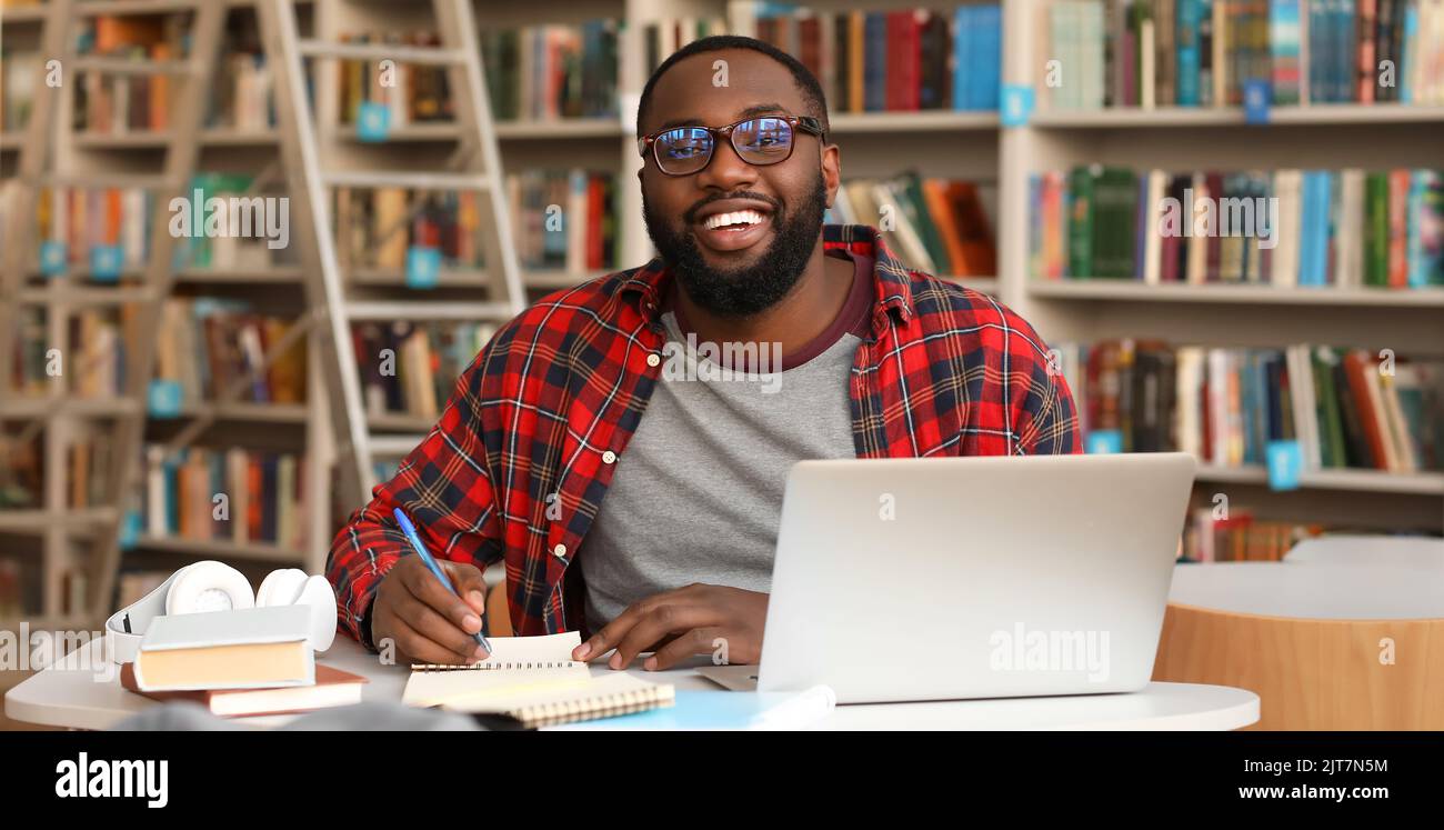 African-American student preparing for exam in library Stock Photo - Alamy