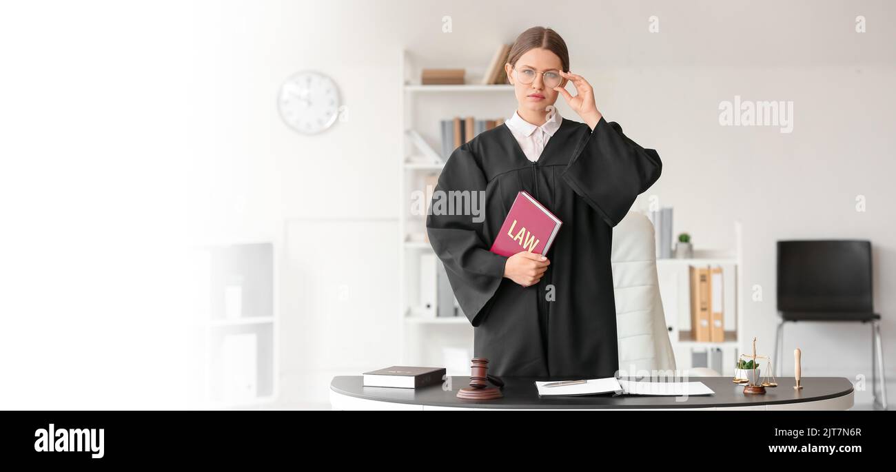 Female judge with law book in office. Banner for design Stock Photo - Alamy
