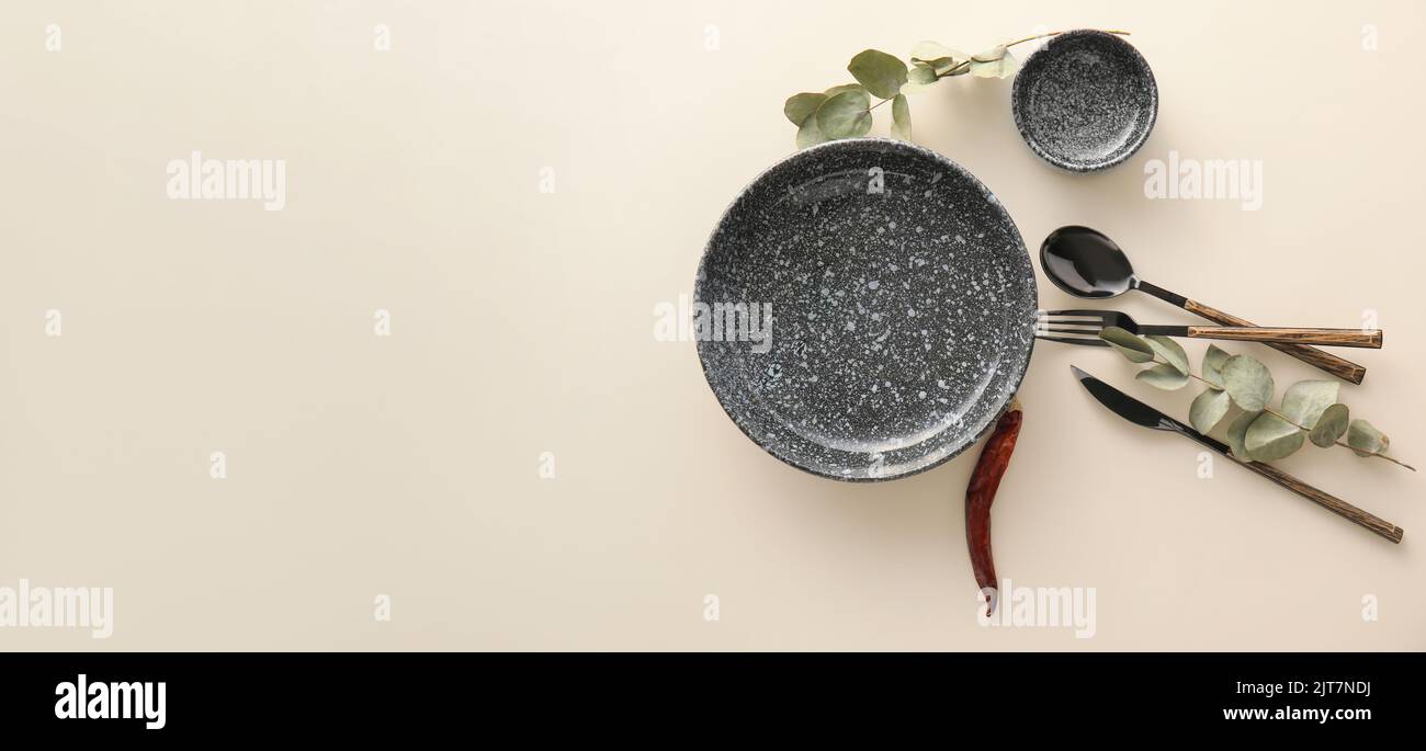 Table setting with eucalyptus branches on light background with space ...