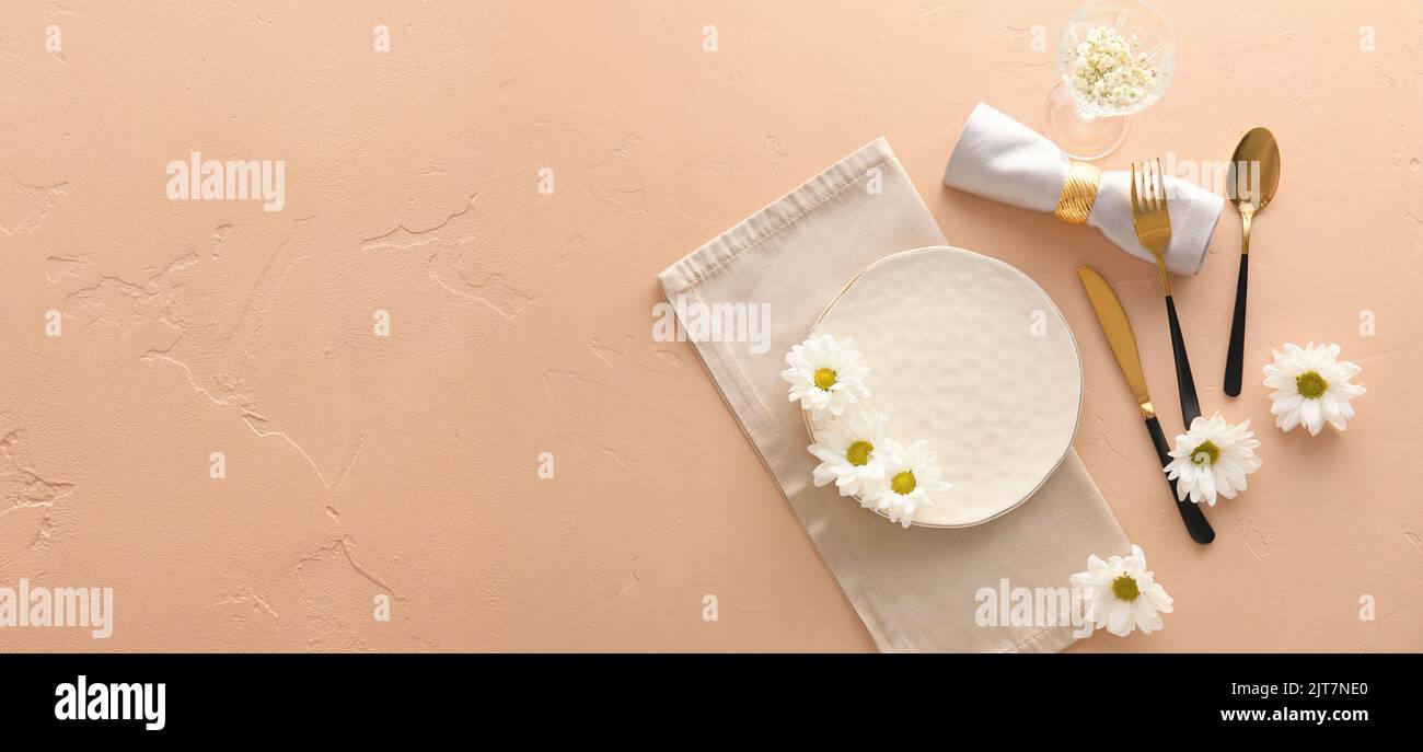Stylish table setting with flowers on beige background with space for ...