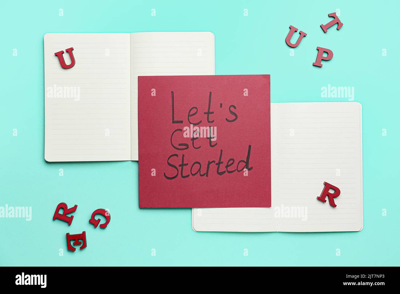 Paper sheet with text LET'S GET STARTED, letters and notebooks on ...