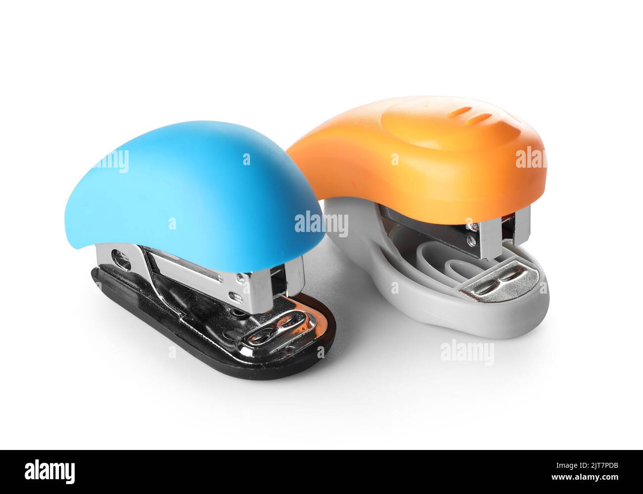 Colorful staplers on white background Stock Photo - Alamy