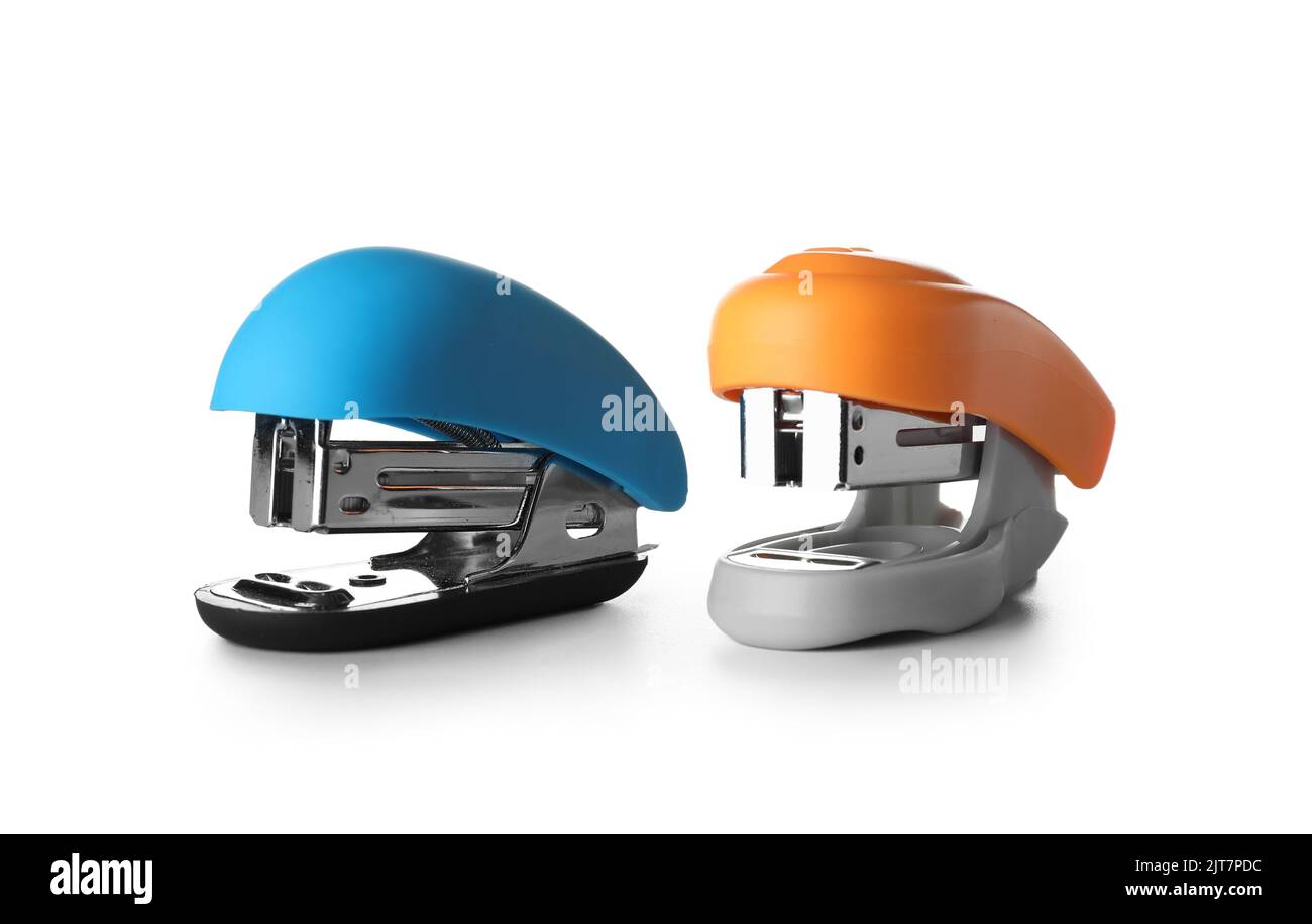 Colorful staplers on white background Stock Photo - Alamy