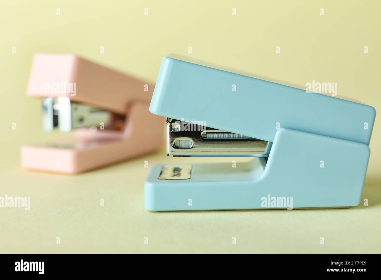 Office staplers on color background, closeup Stock Photo - Alamy
