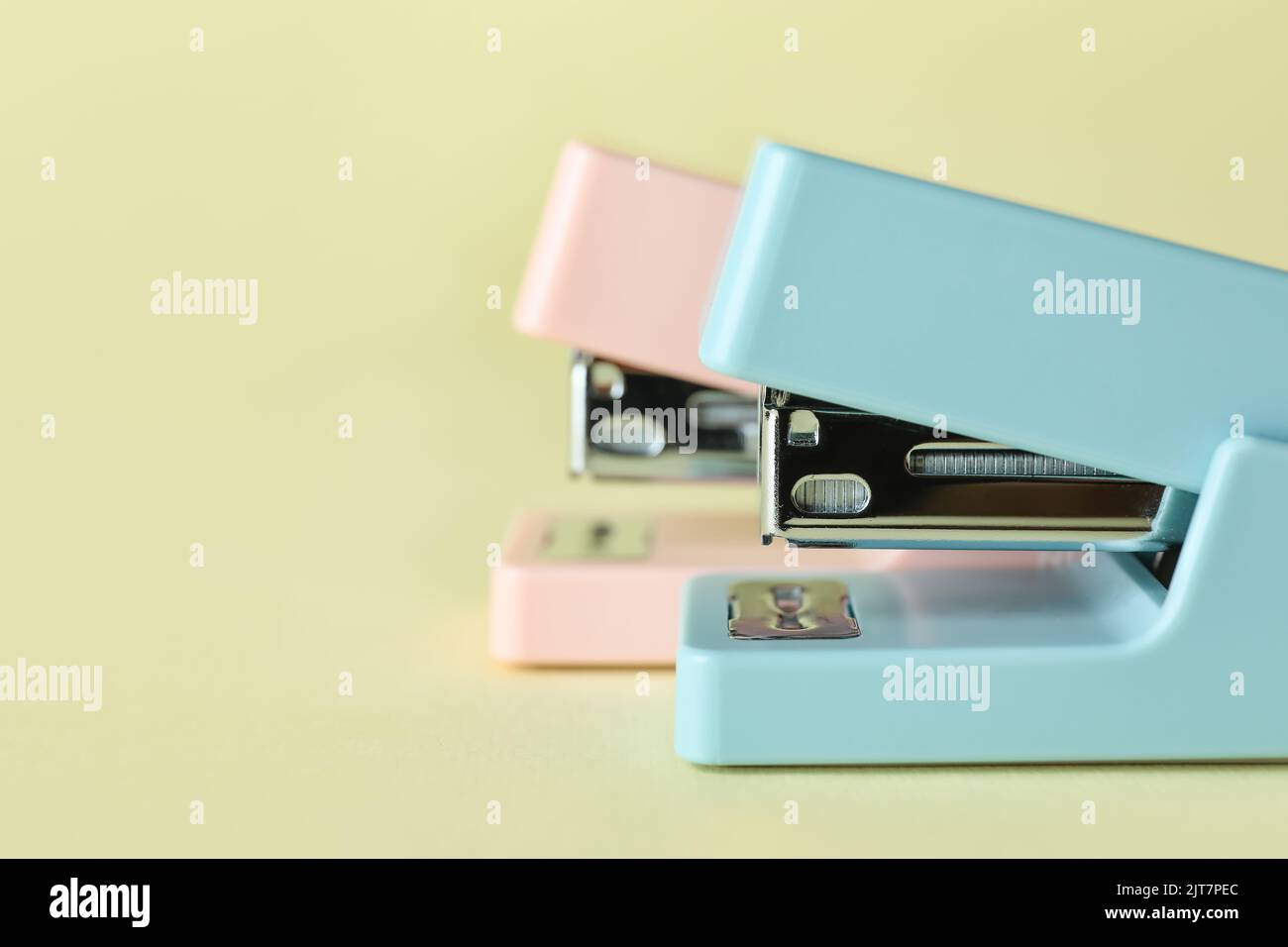 Office staplers on color background, closeup Stock Photo - Alamy