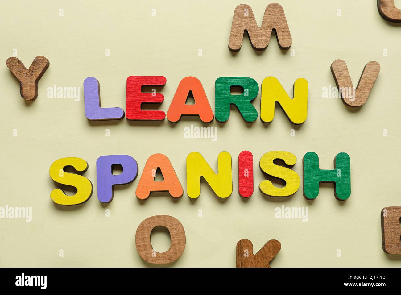 Text LEARN SPANISH with letters on beige background Stock Photo - Alamy