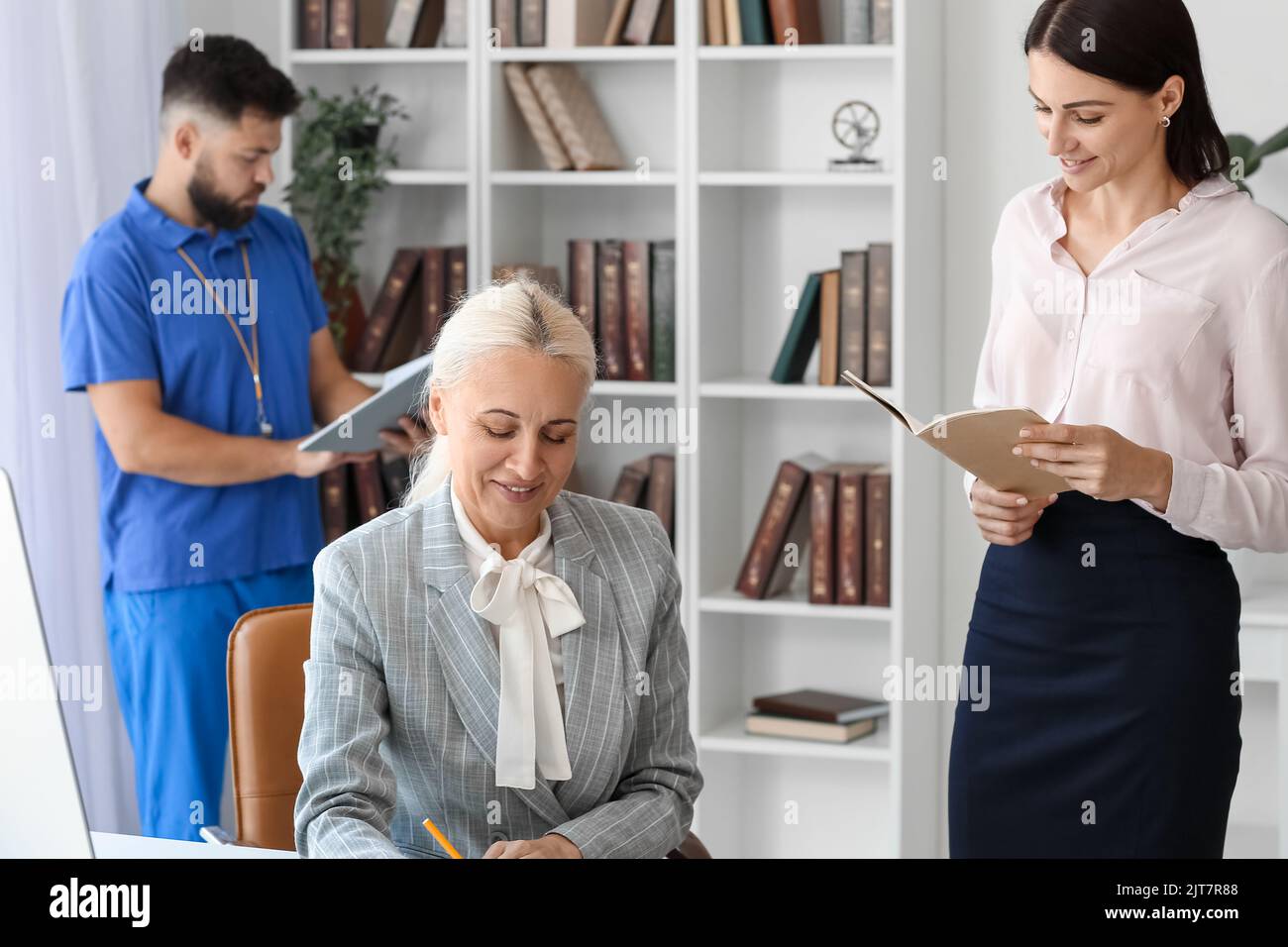Different teachers working in school Stock Photo - Alamy
